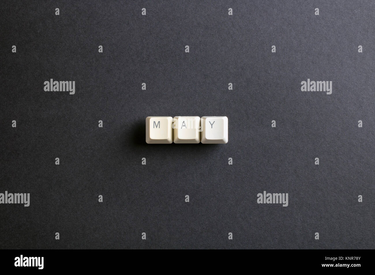May month word is written with computer keys button. Flat lay view from above on the table with ...