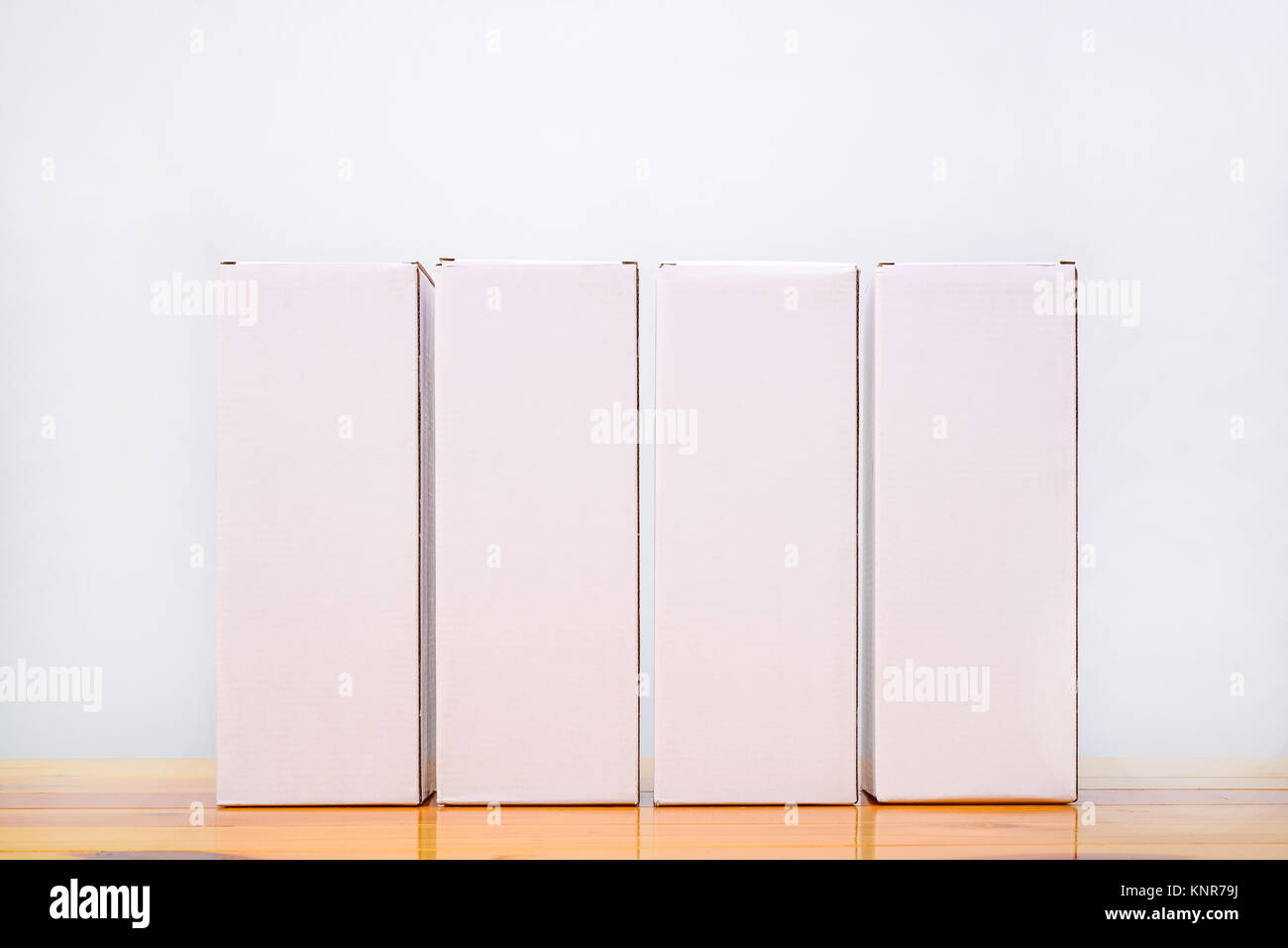 Empty four Package white cardboard box mock up for long items on bright ...