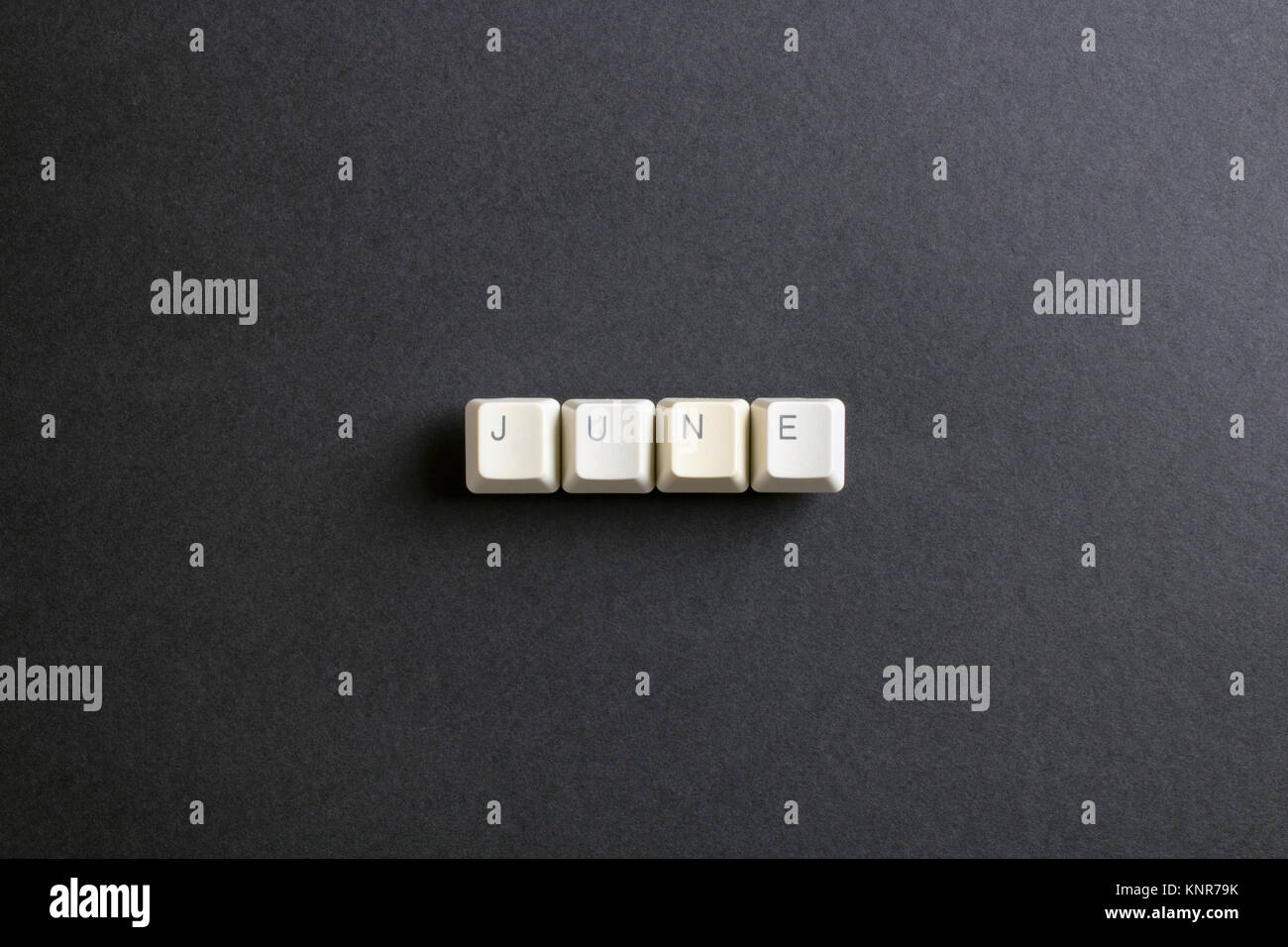 June month word is written with computer keys button. Flat lay view ...