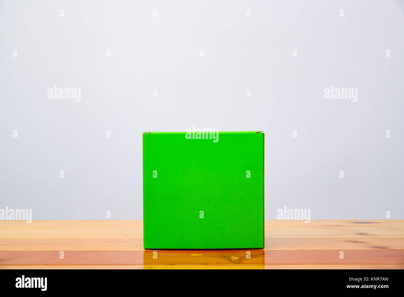 Empty Package green cardboard box mock up for product items on bright ...
