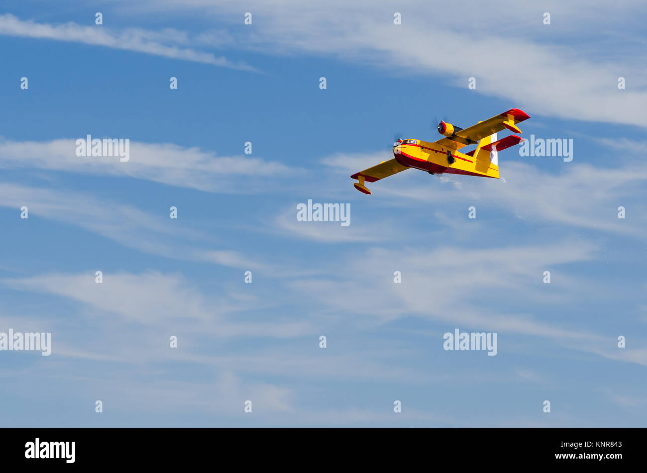 Radio controlled model hydroplane flying over blue sky Stock Photo - Alamy