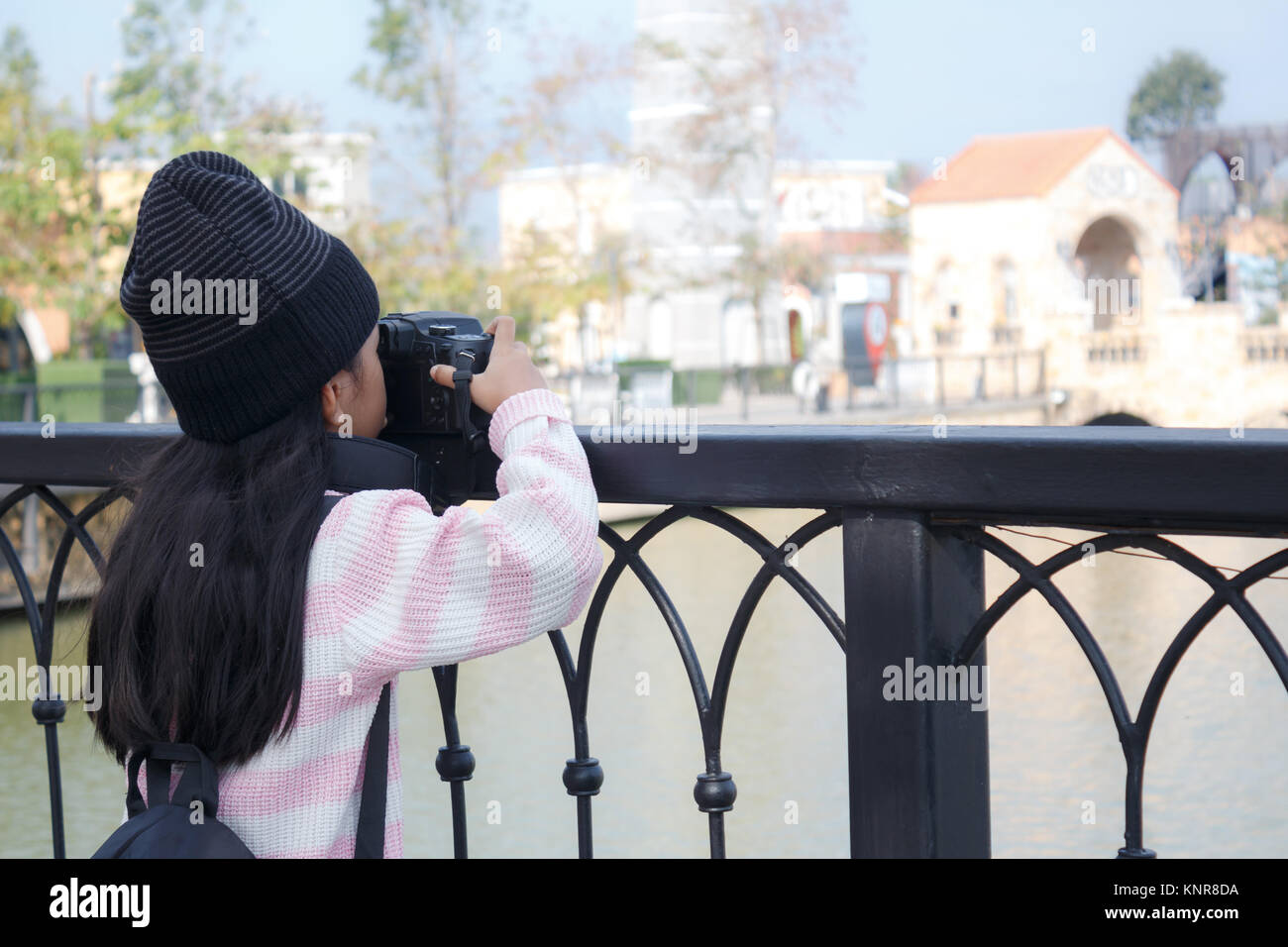 Asian little girl taking photo by shooting camera with happiness ...