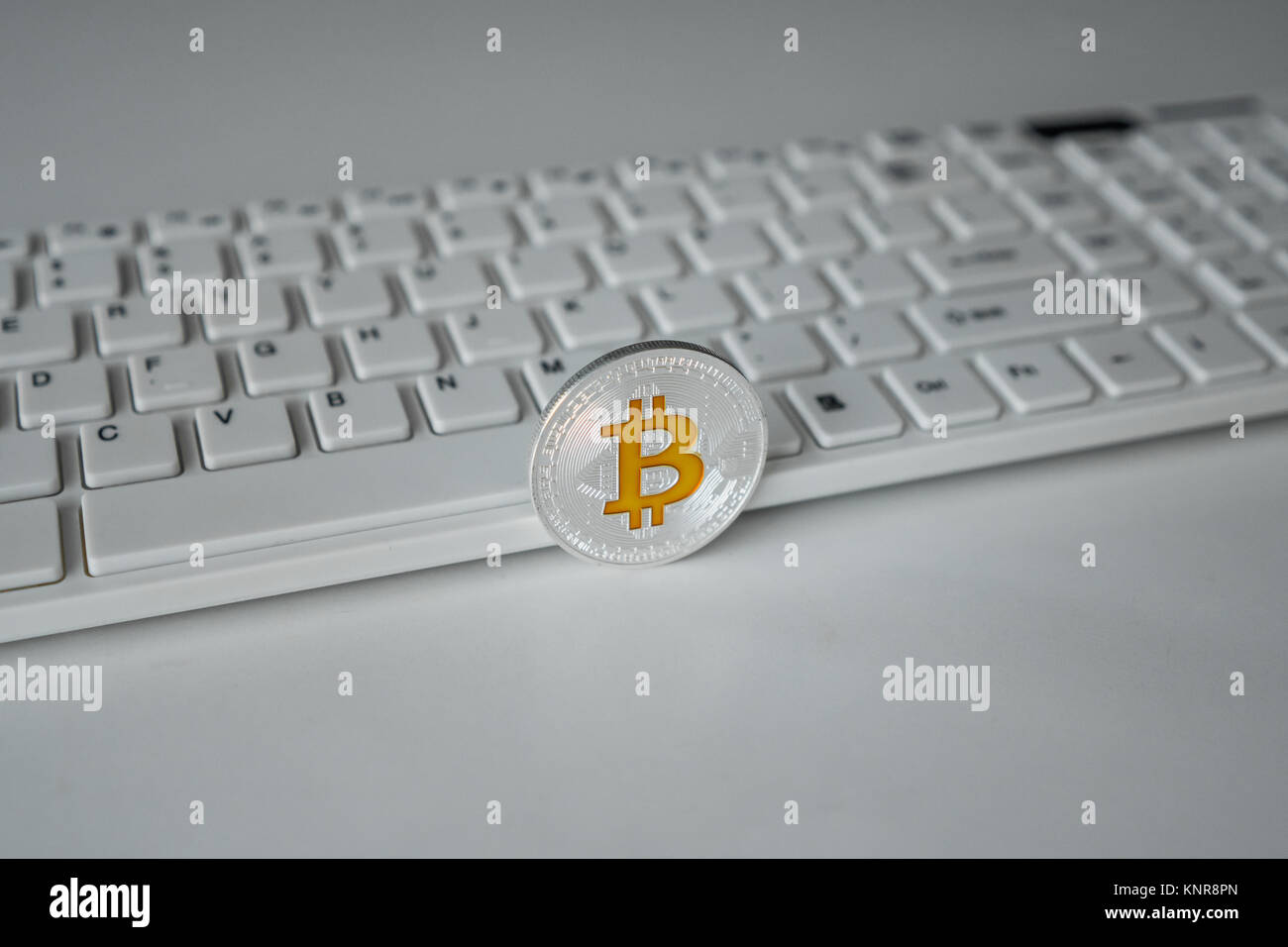 Virtual currency Bit coins on the keyboard background. Crypto currency ...