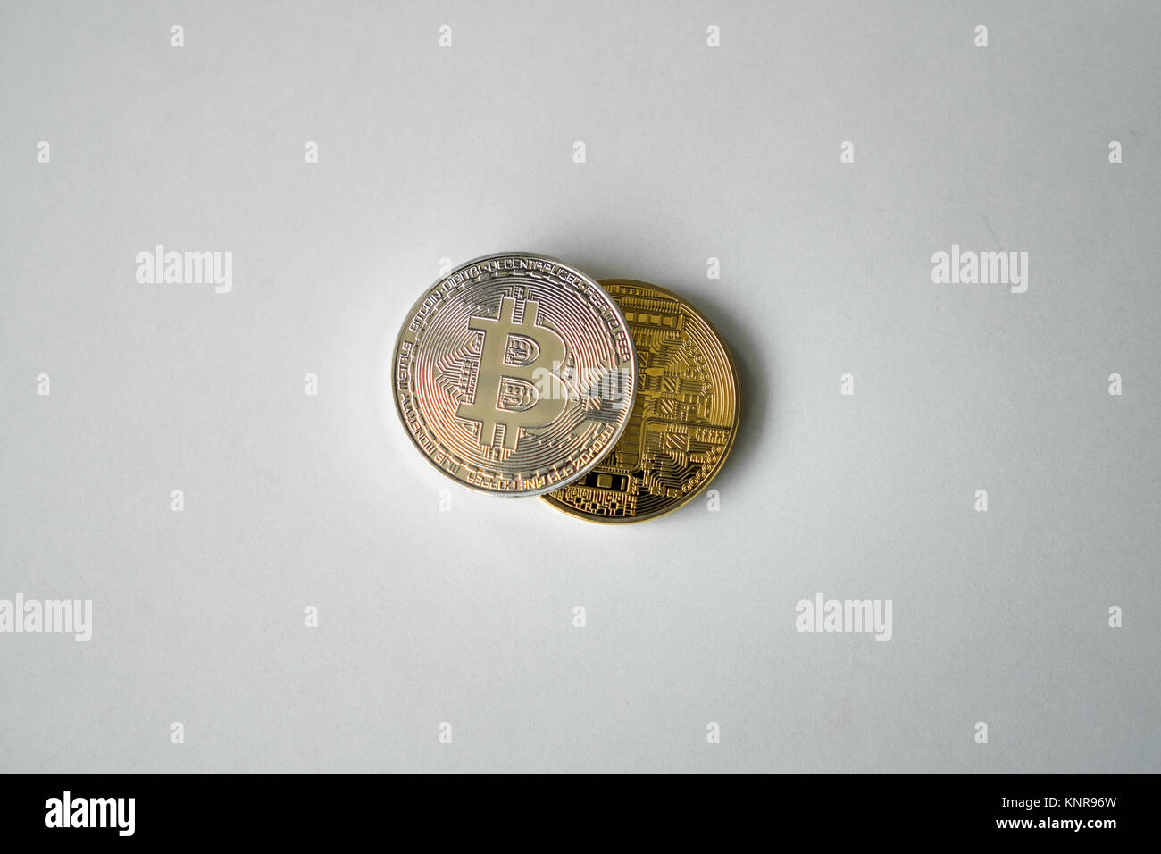 Silver and gold coins bit of a koin on a white background. Virtual ...