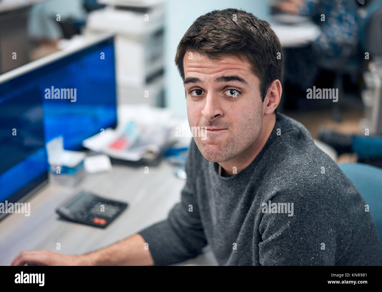 man working at computer in office Stock Photo - Alamy