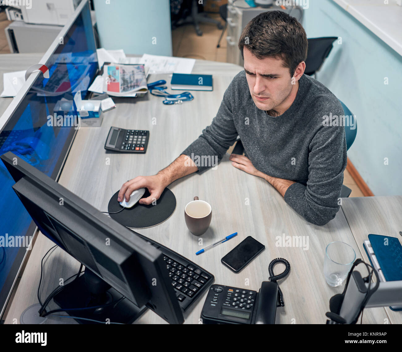 man working at computer in office Stock Photo - Alamy