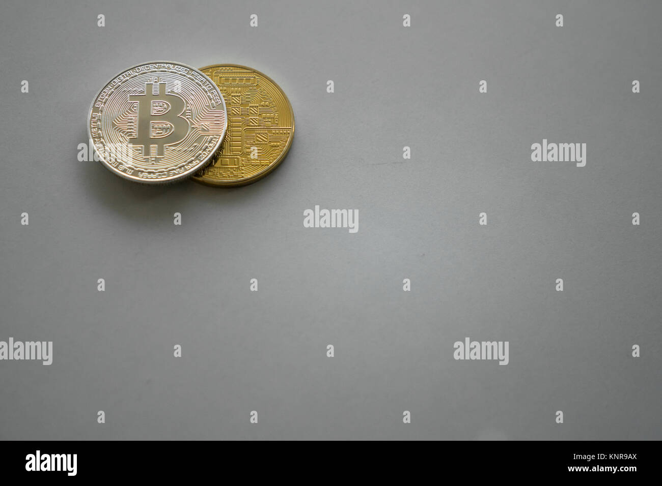 Silver and gold coins bit of a koin on a white background. BTC. Virtual ...