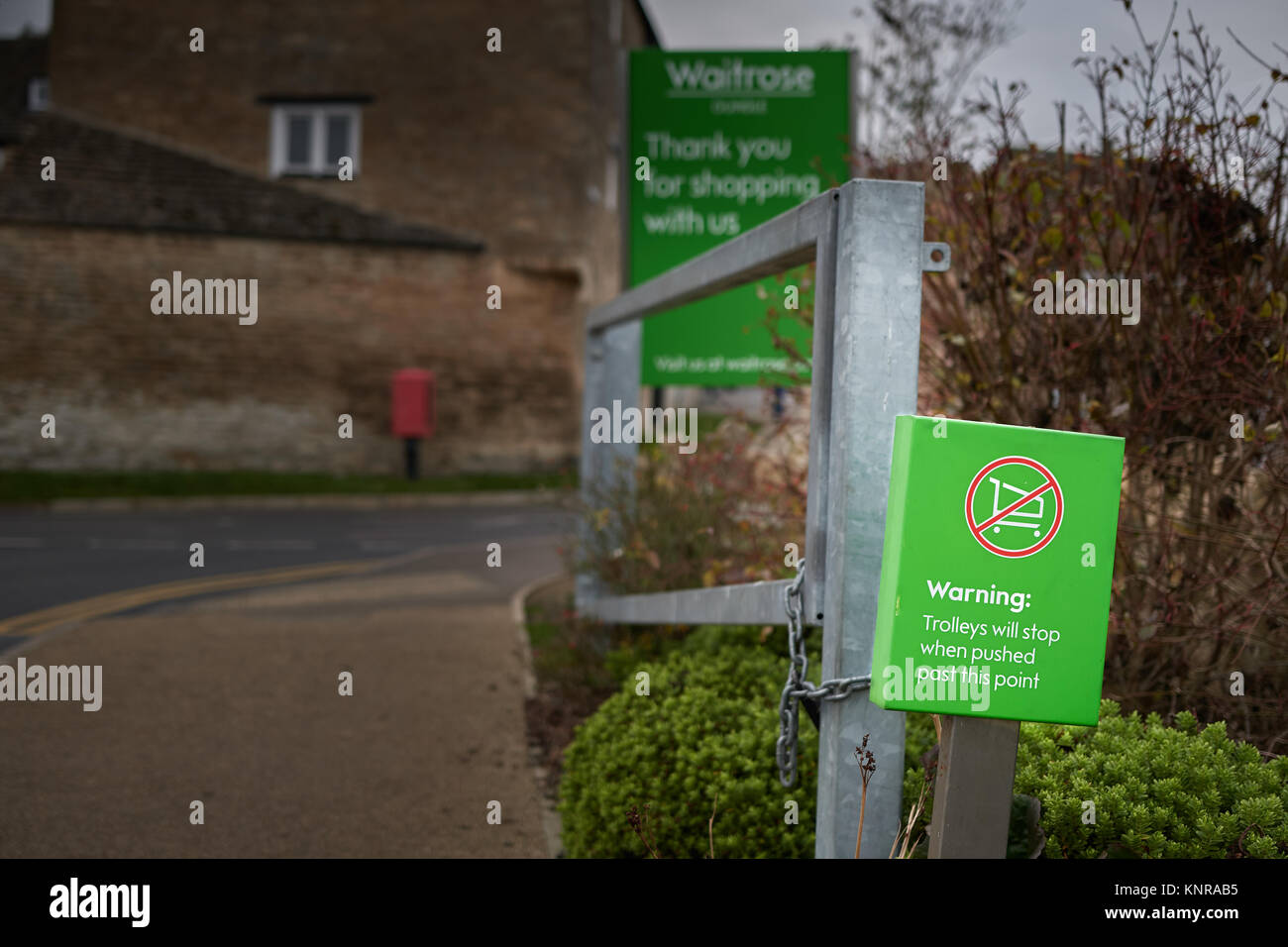 Warning sign about trolleys at the Waitrose supermarket in the country ...