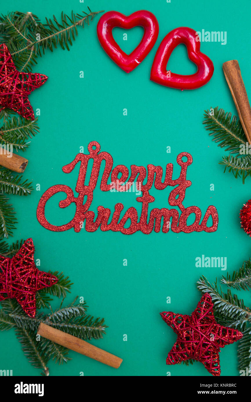 Red gleaming Merry Christmas inscription on a green one-color ...