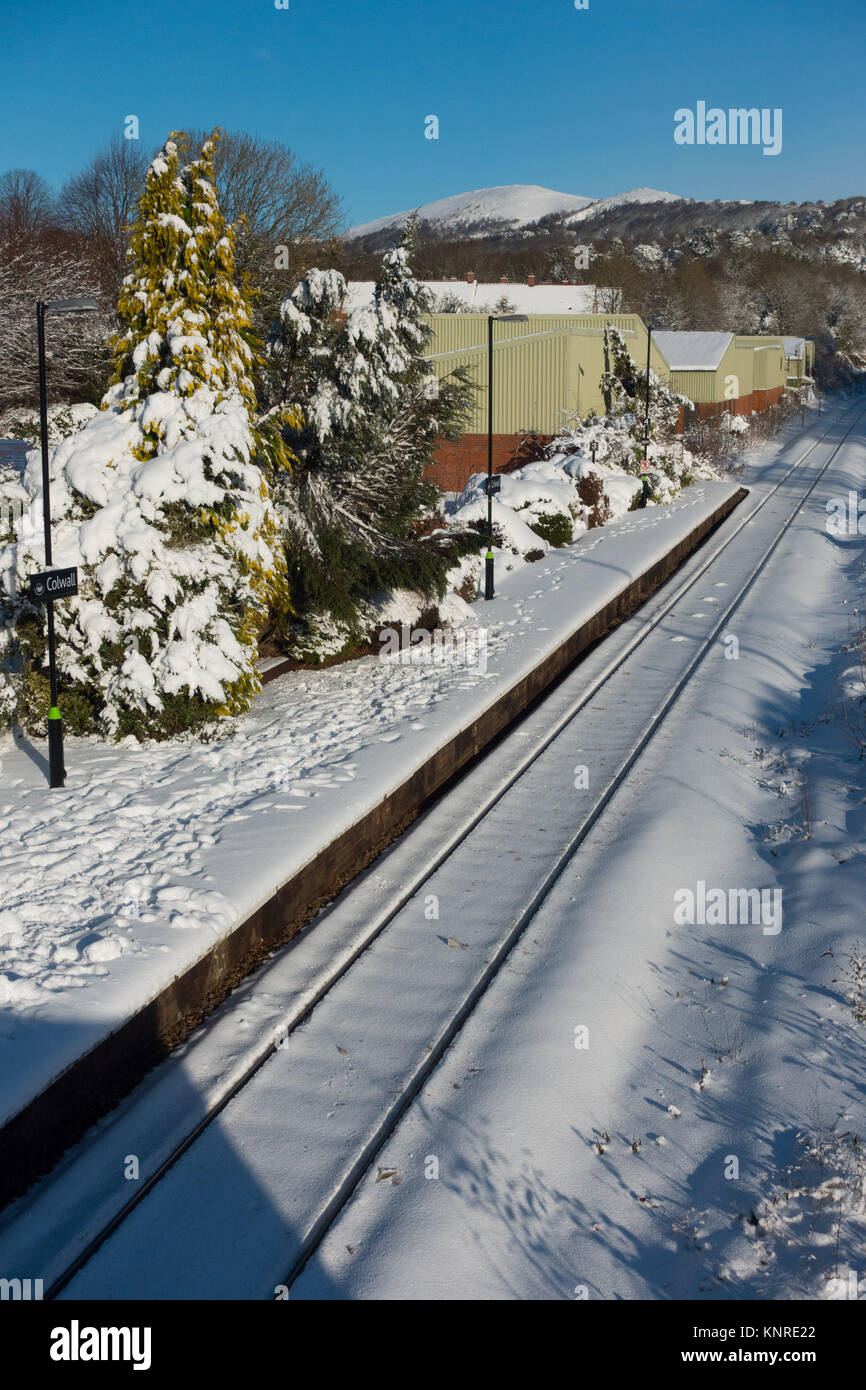 Snow covered railway station at Colwall, Herefordshire, with The ...