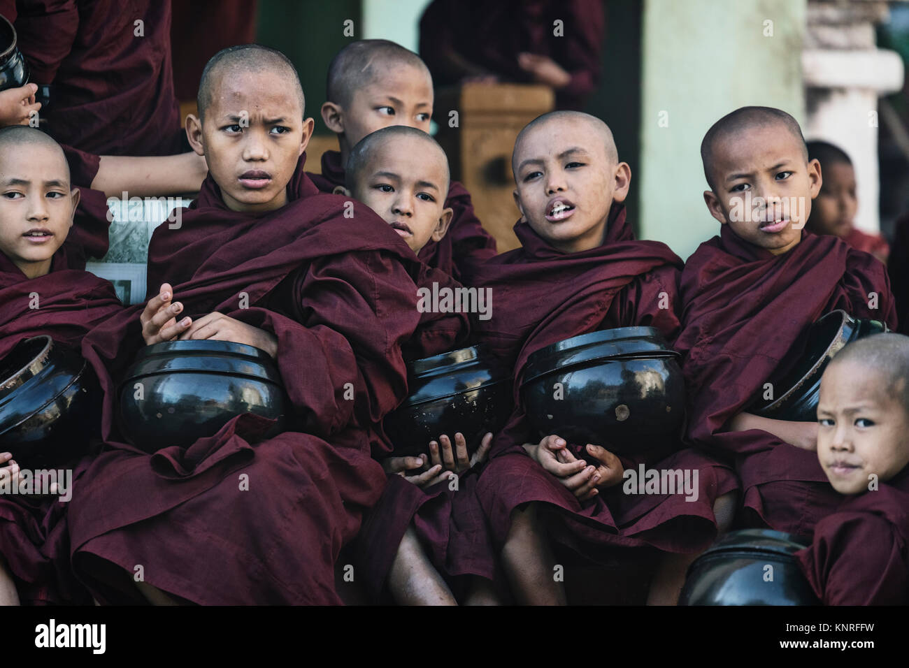 monks waiting for food in Myin Ka Bar, Bagan, Myanmar, Asia Stock Photo ...