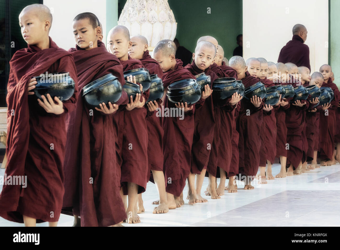 monks waiting for food in Myin Ka Bar, Bagan, Myanmar, Asia Stock Photo ...