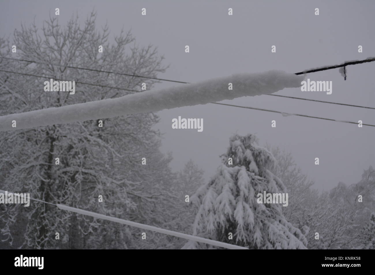 power lines and telephone wires in harsh landscape during a very heavy ...