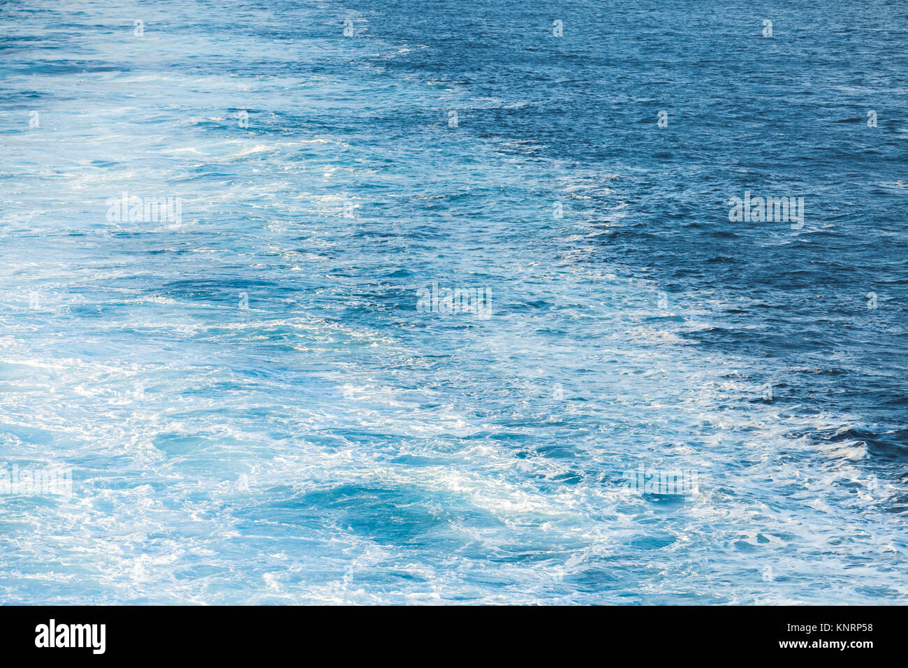 Big ship wake over blue sea water, background texture Stock Photo - Alamy