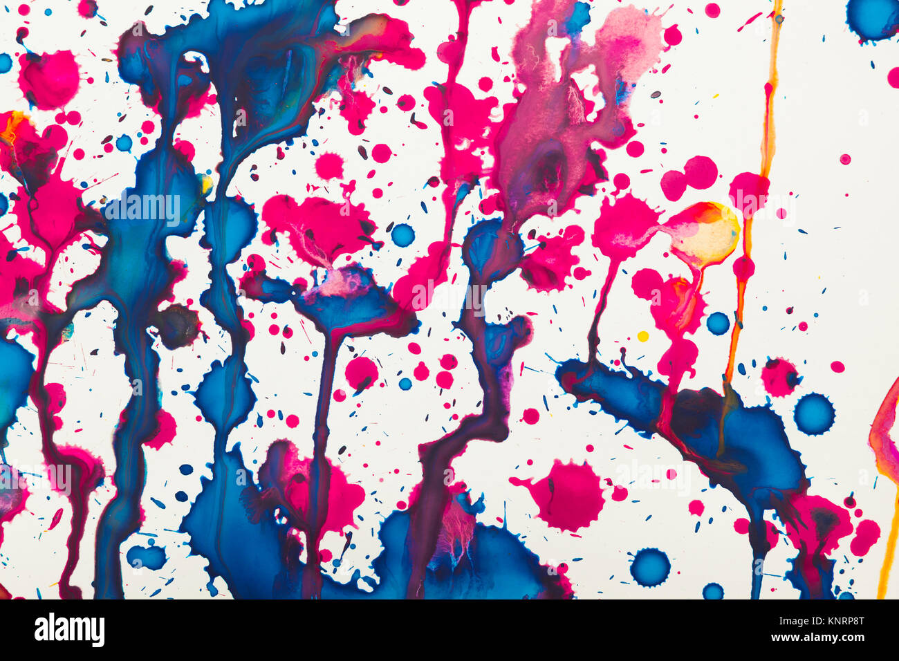 Colorful paint splashes artistic pattern over white paper, background ...