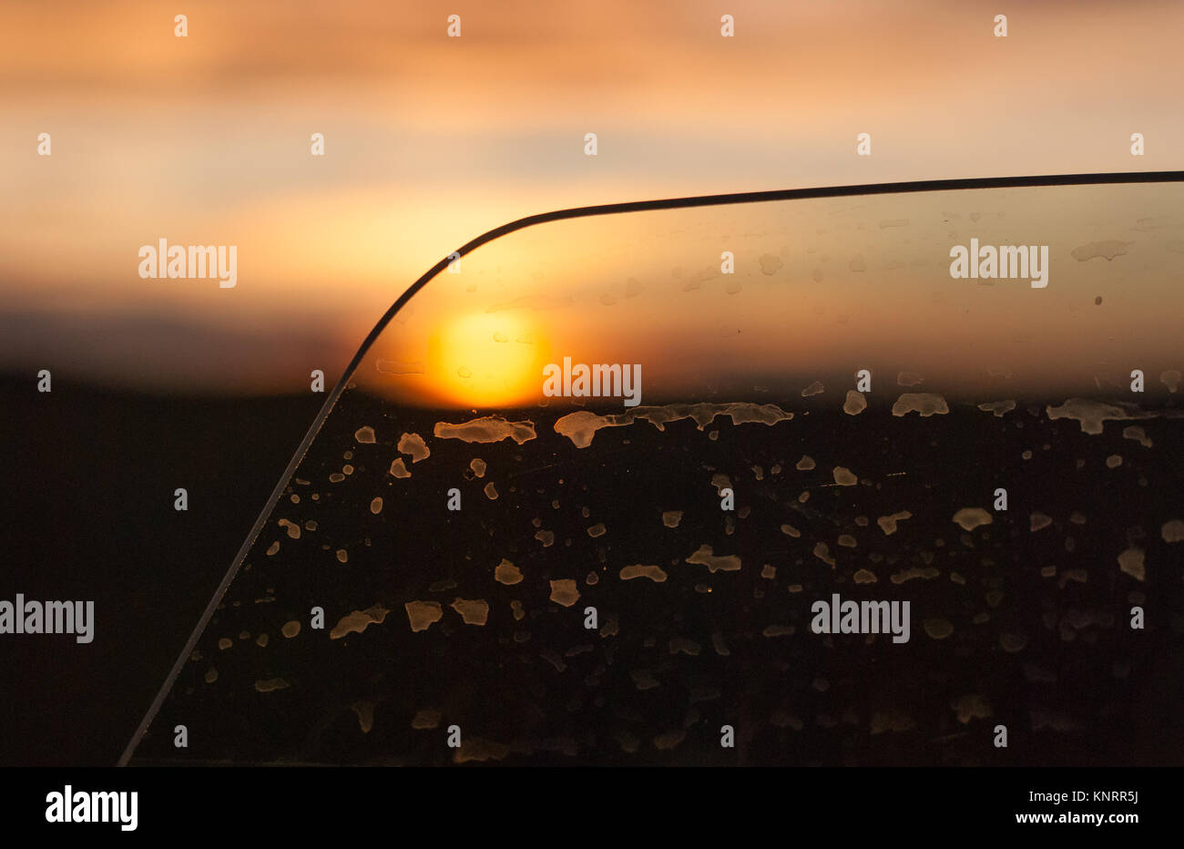 View of the sundown through a slightly open car window Stock Photo - Alamy