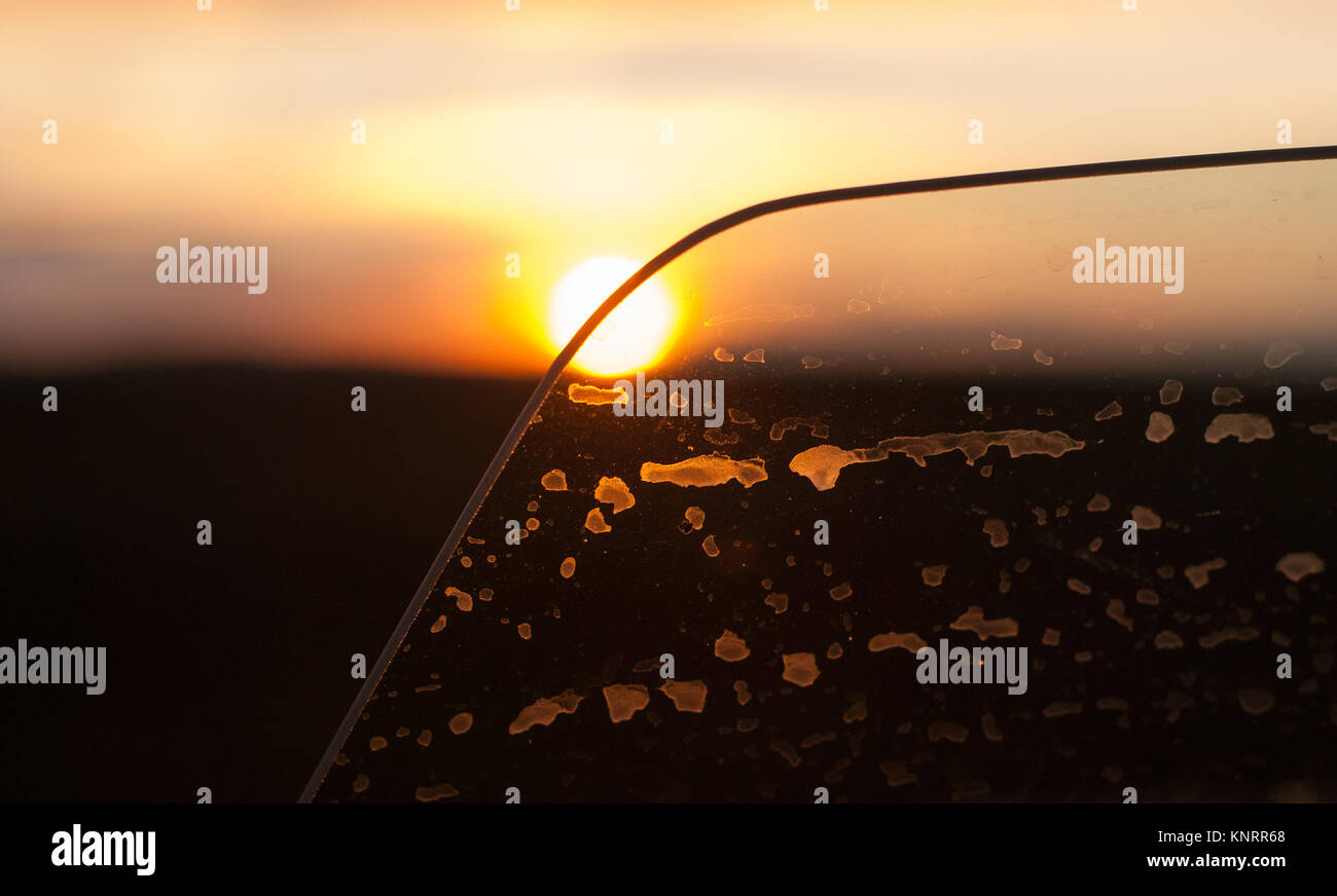 View of the sundown through a slightly open car window Stock Photo - Alamy