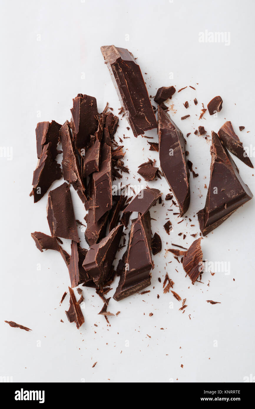 Chocolate pices on white wood, sweet food Stock Photo - Alamy