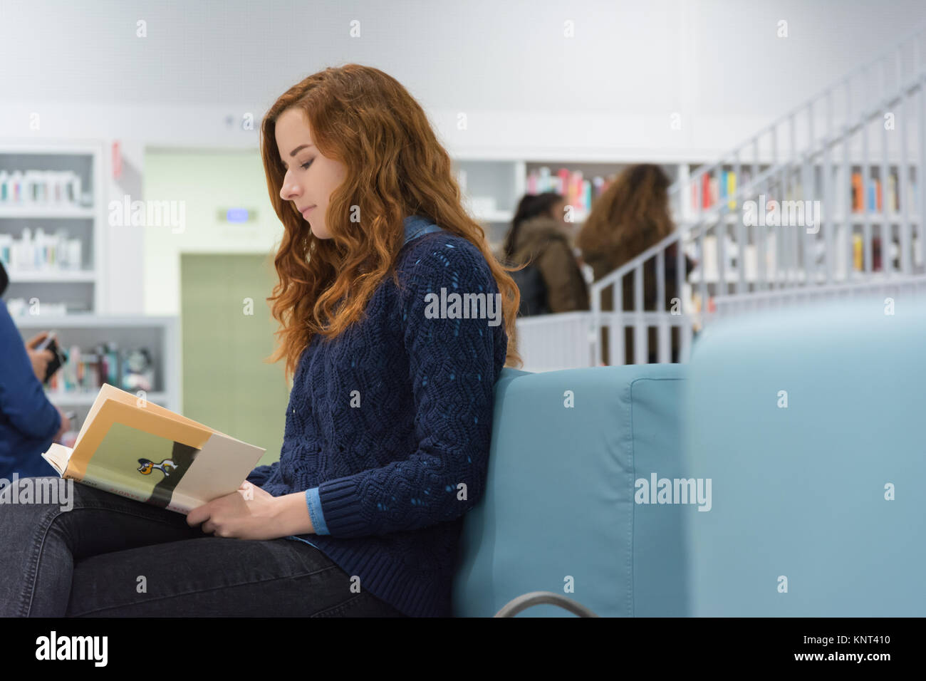 Clever University Student Studying in White Modern Library Books Stock ...