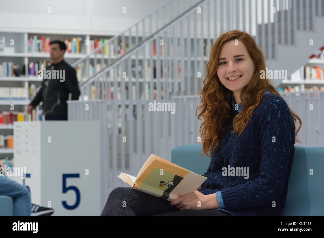 Clever University Student Studying in White Modern Library Books Stock ...