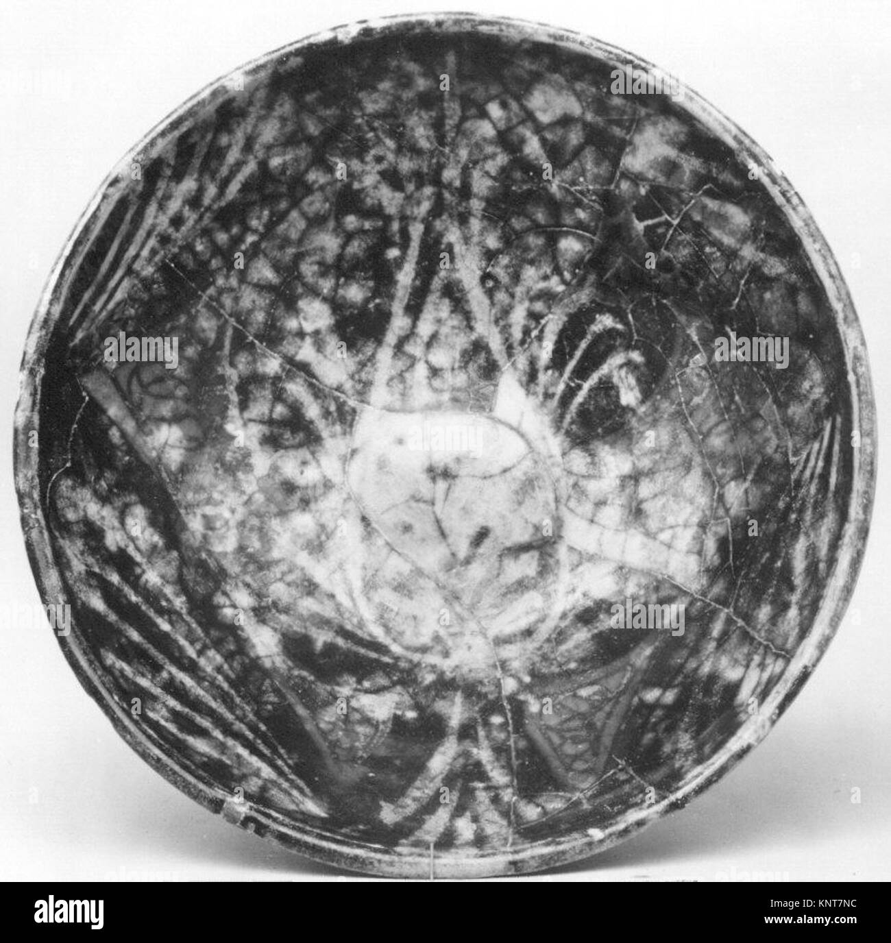 A historic bowl with a simple rounded shape and functional design. The ...