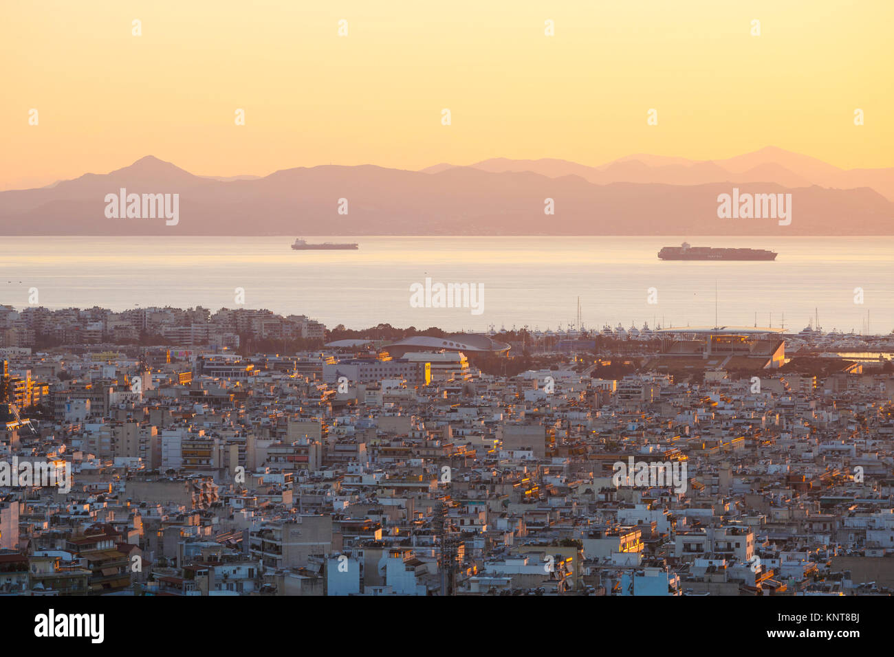 View of Athens from Filopappou hill towards Aegina island and Peloponnese at sunset, Greece ...