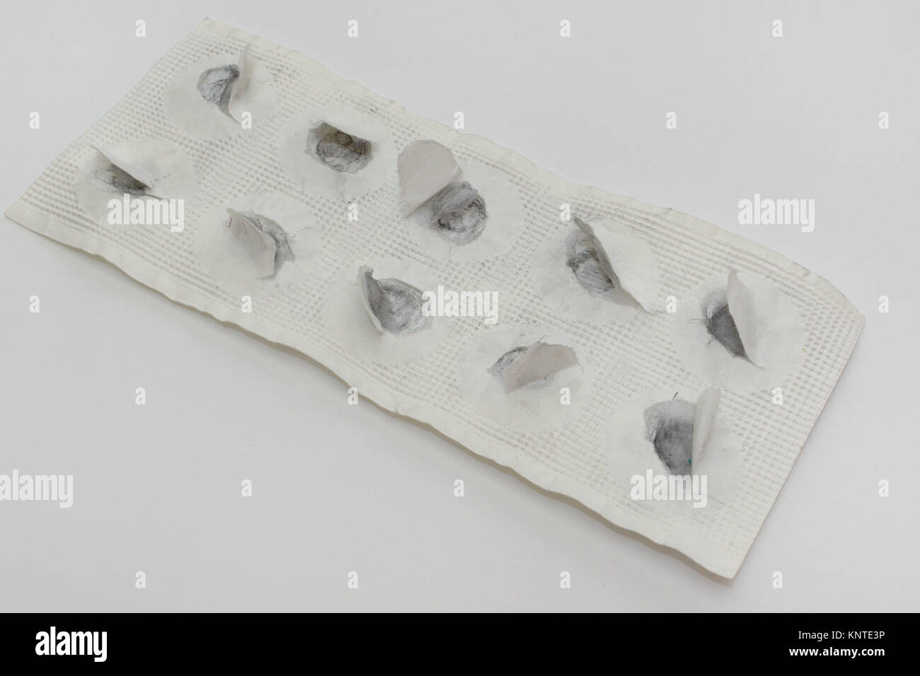 pills plate of remedy for food poisoning. all tablets taken, paper torn ...