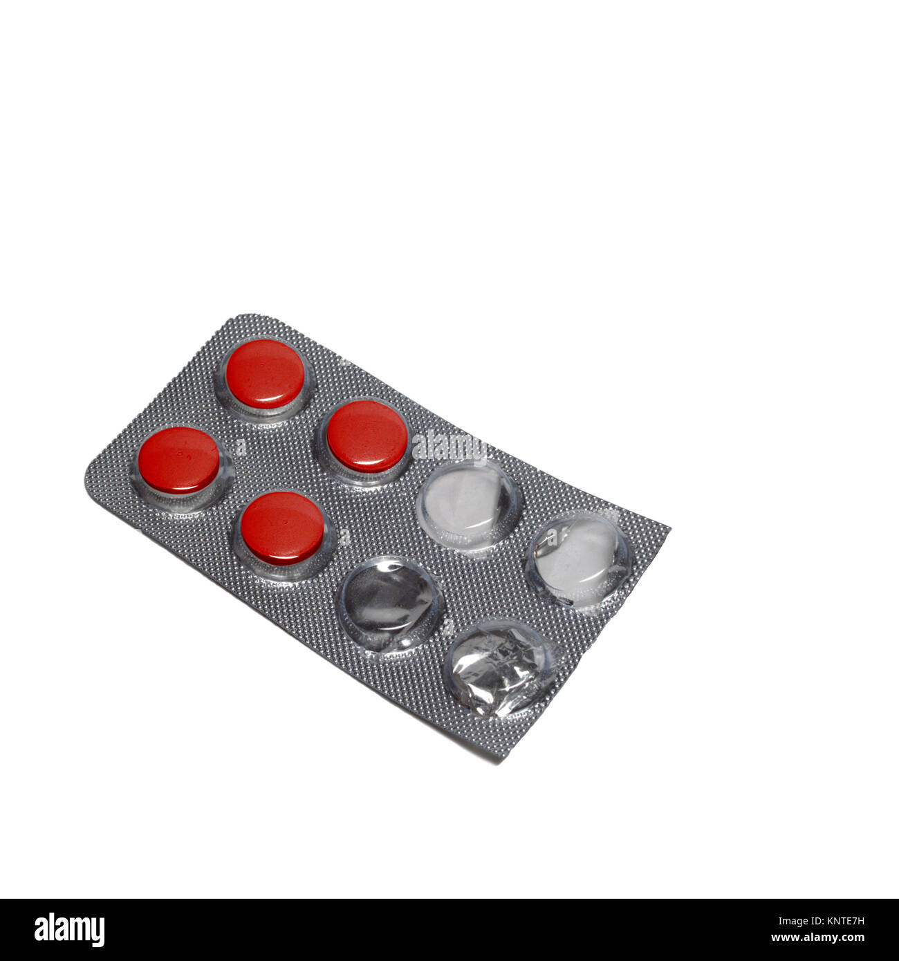 fragment of the packing of bright red pills Stock Photo - Alamy