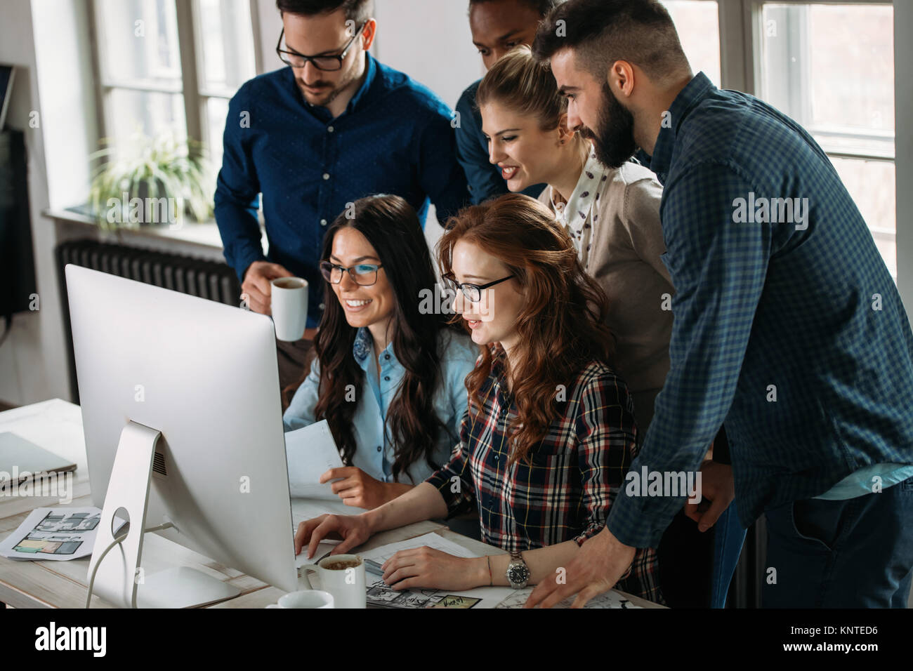 Company employees working in software development and designer office ...