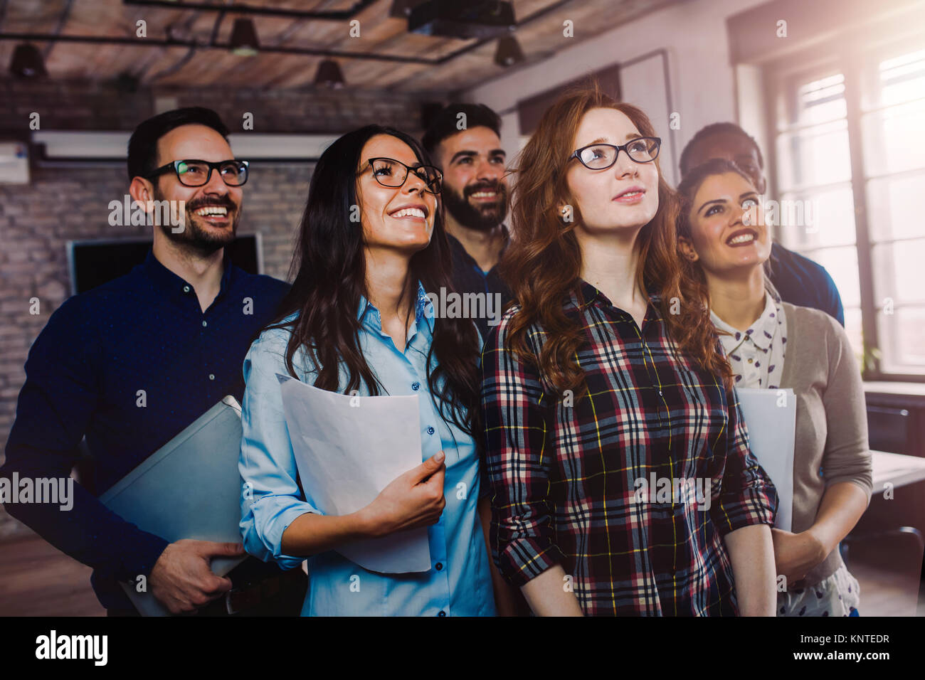 Happy group of successful company employees in office Stock Photo - Alamy