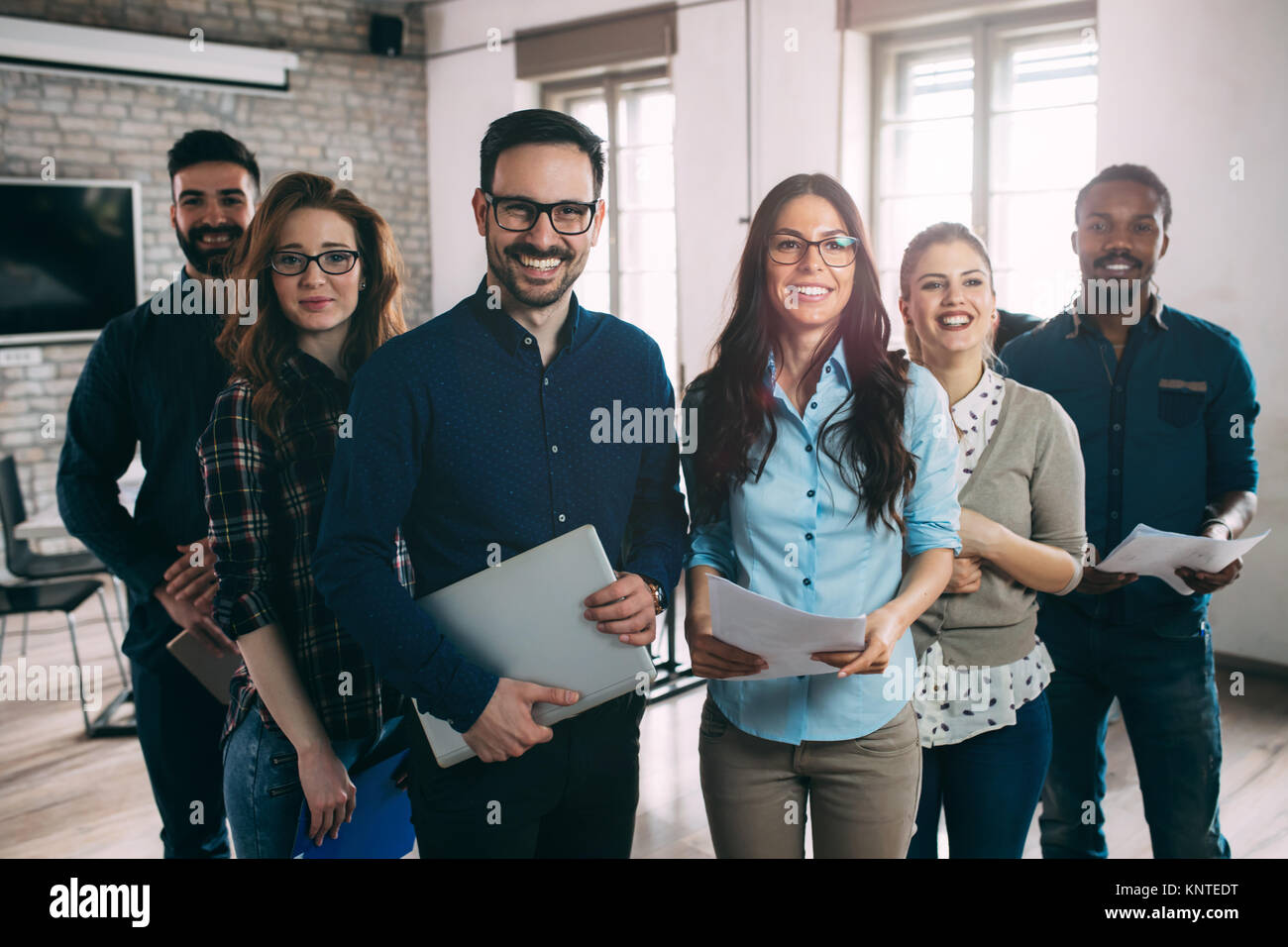 Successful company with happy employees in modern office Stock Photo ...