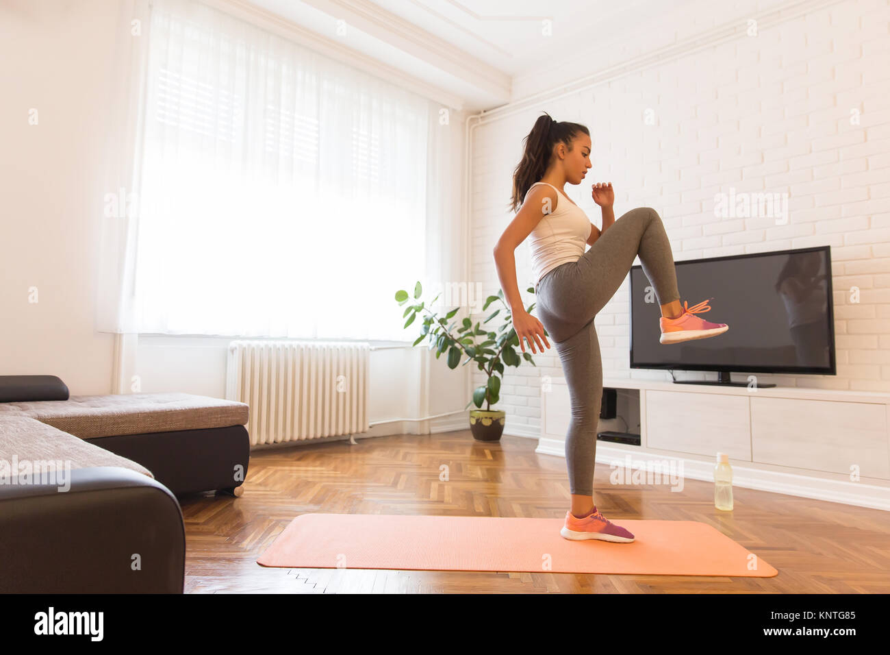 Fit woman exsercise in the room at home Stock Photo - Alamy