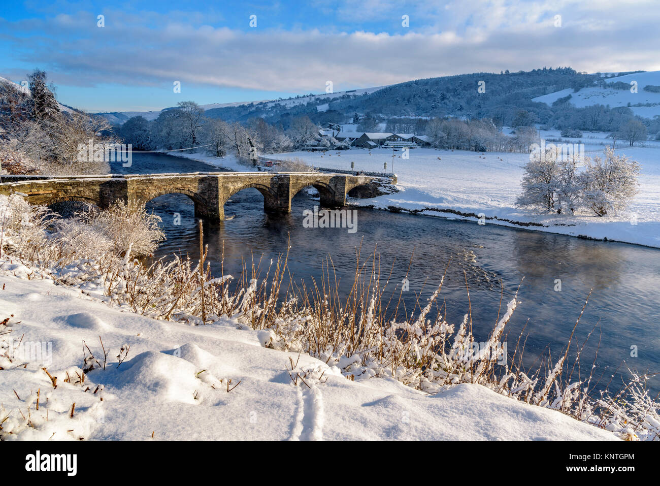 Snowy scene North Wales River Dee by the old stone bridge at Carrog ...