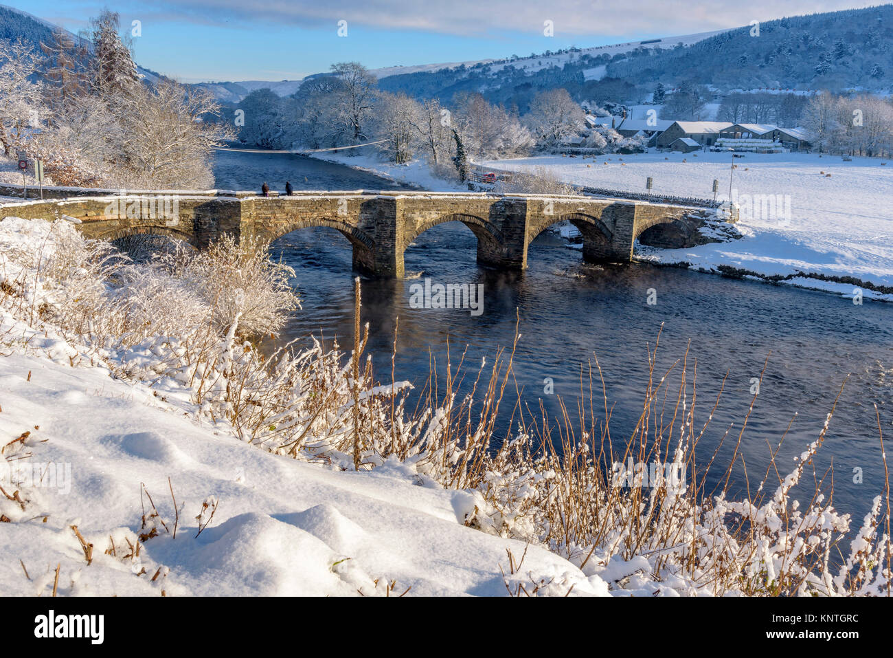 Snowy scene North Wales River Dee by the old stone bridge at Carrog ...