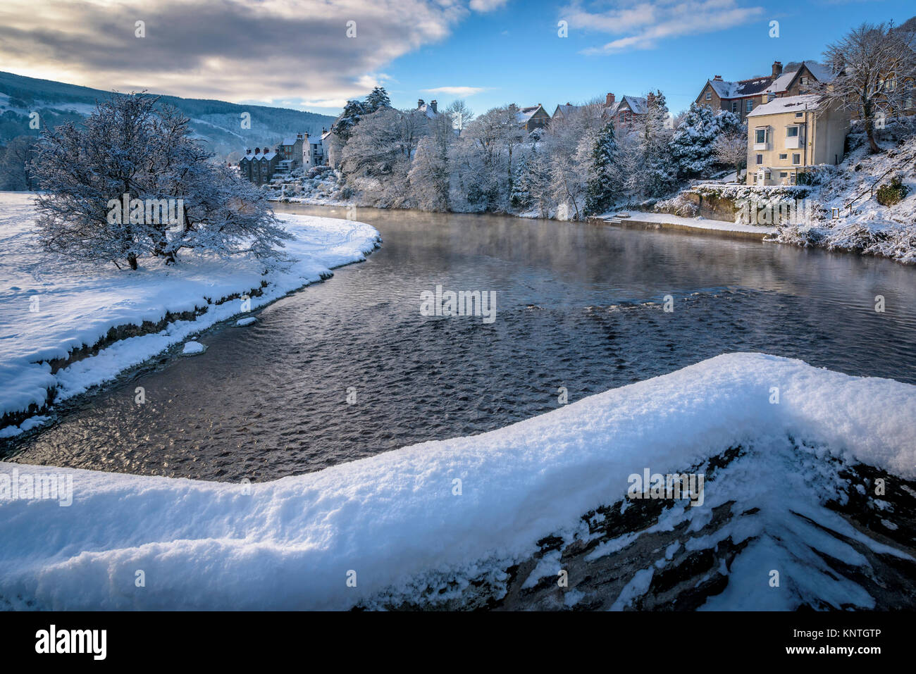 Snowy scene North Wales River Dee by the old stone bridge at Carrog ...