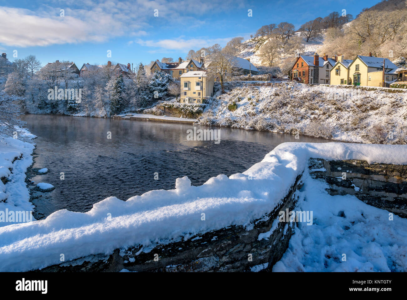 Snowy scene North Wales River Dee by the old stone bridge at Carrog ...