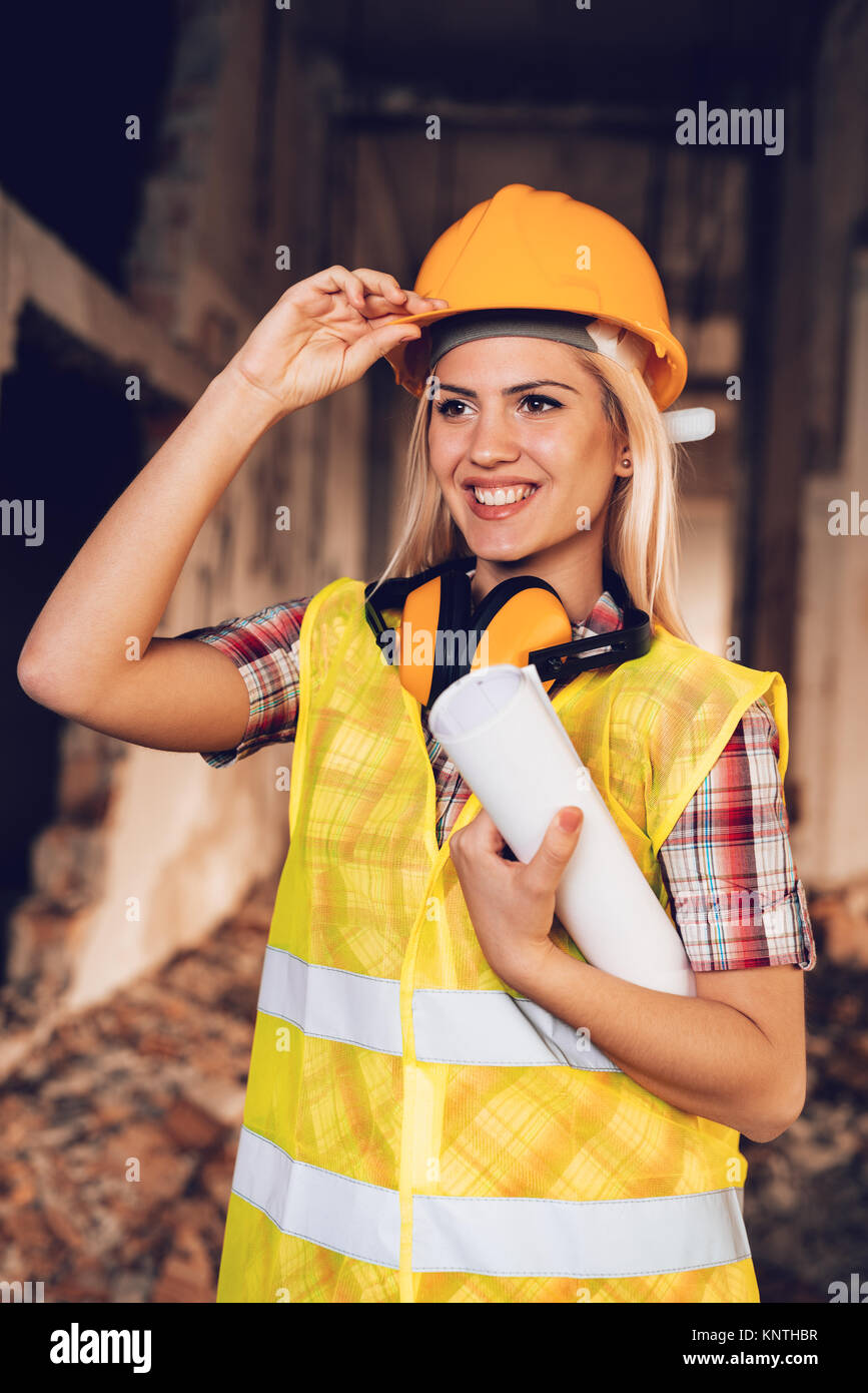 Beautiful young female construction architects at a construction site ...