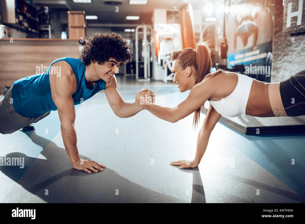 Young muscular couple doing doing hard workout at the gym Stock Photo ...