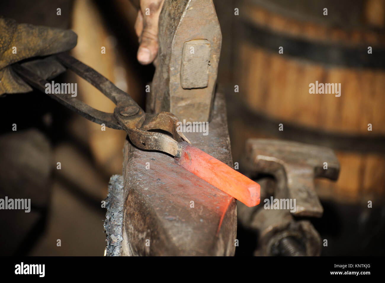 Blacksmith working in the forge processes the metal . The photograph on ...