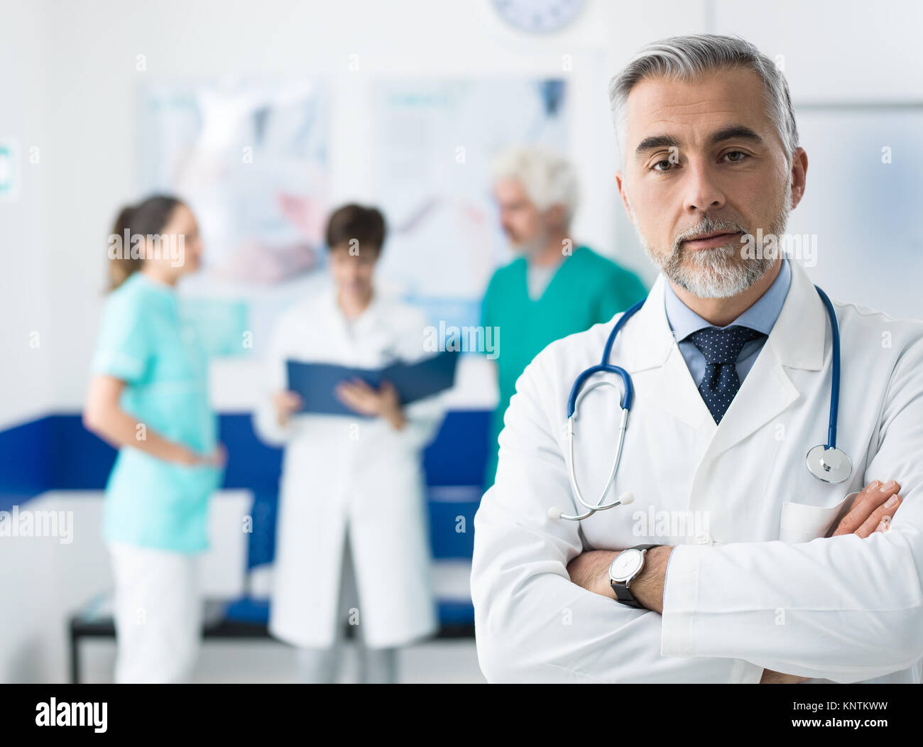 Professional medical team working at the hospital and confident doctor ...