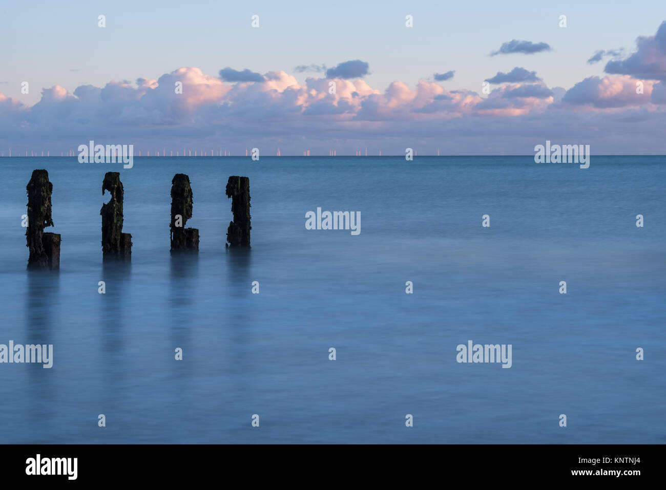 Picturesque scenic landscape view of sea defence groynes and ...