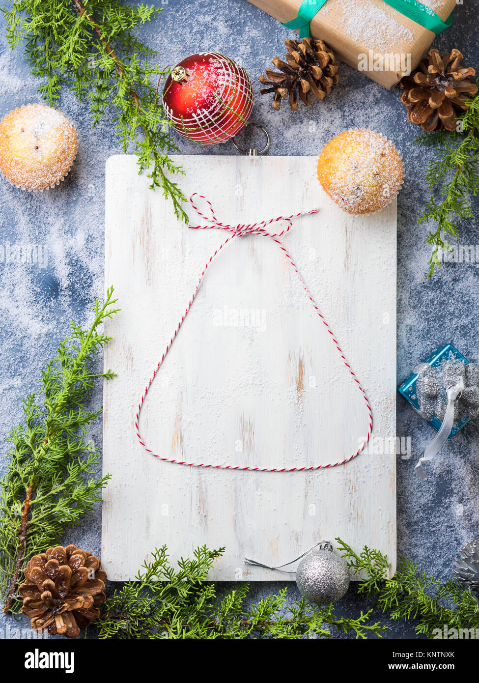 Christmas flat lay background with twine bell frame on white wooden ...