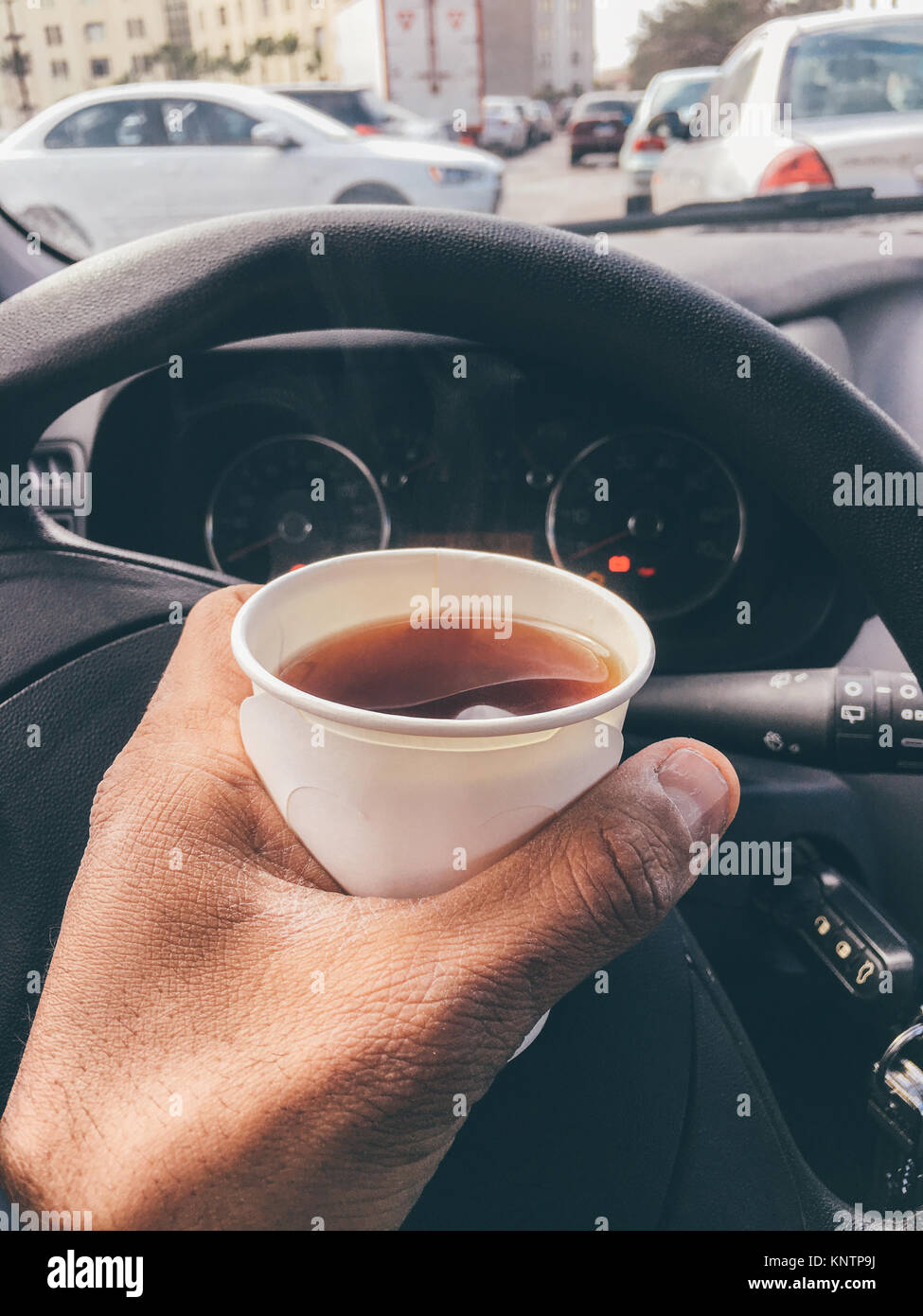 Man hold hot tea paper cup in car Stock Photo - Alamy