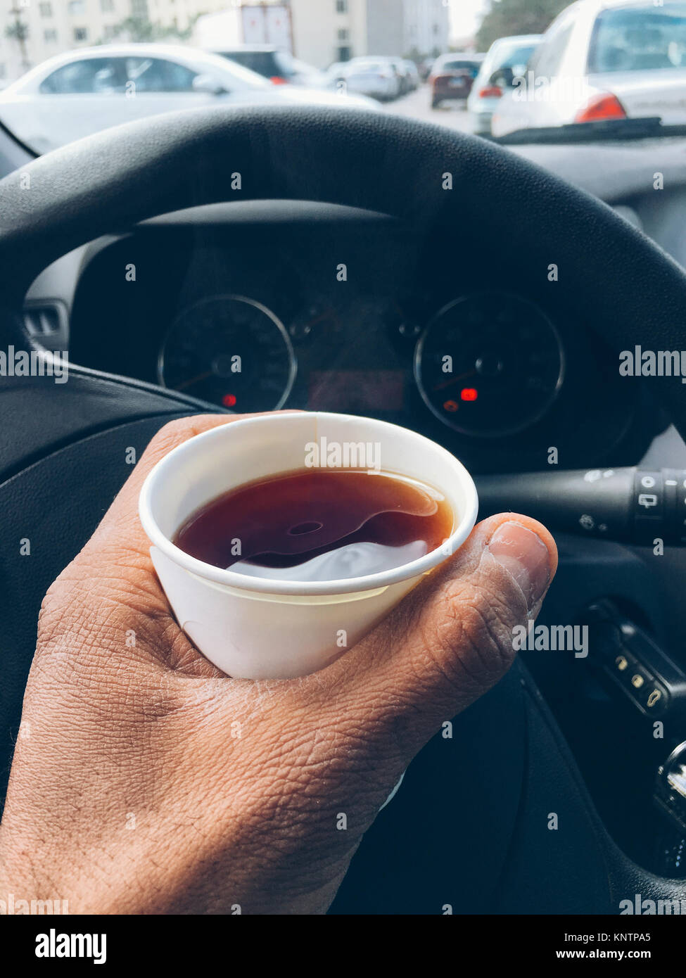 Man hold hot tea paper cup in car Stock Photo - Alamy