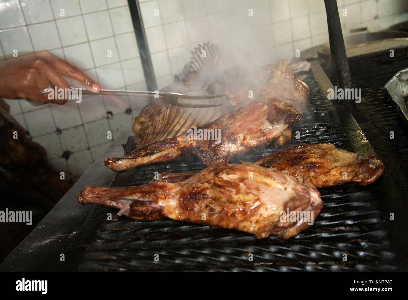 Nyama Choma or traditional street food of grilled meat bbq served in a ...