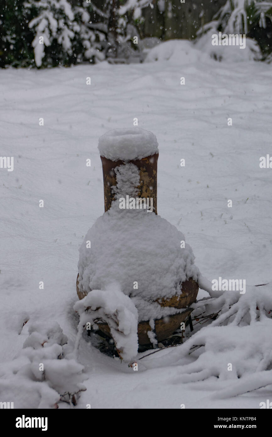 Snow covered chimera and garden Stock Photo - Alamy