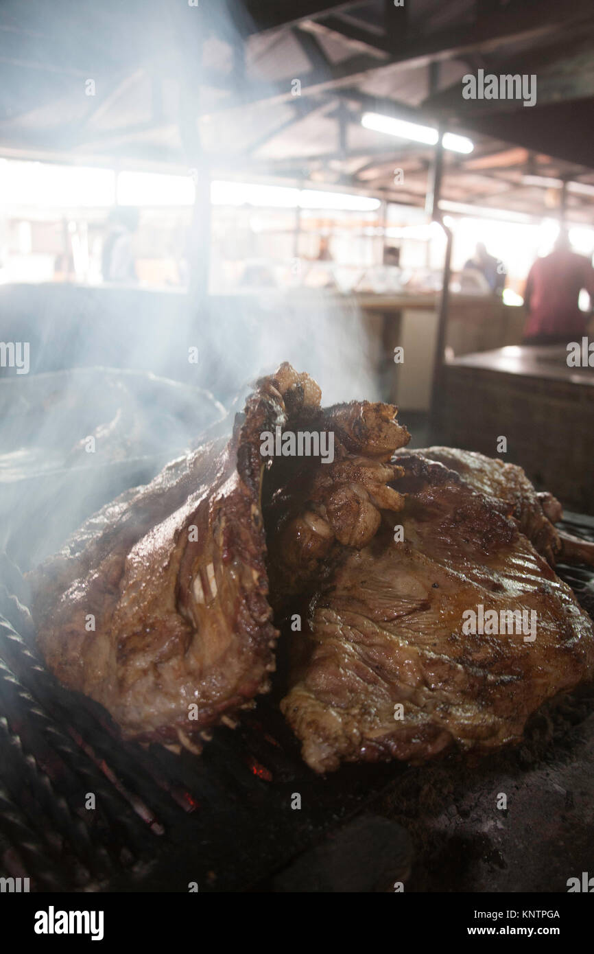 Nyama Choma or traditional street food of grilled meat bbq served in a ...