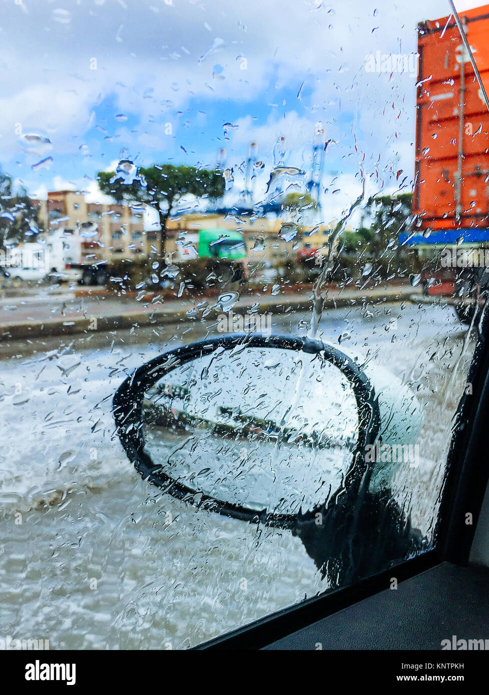 Fast truck splash water on car side window Stock Photo - Alamy