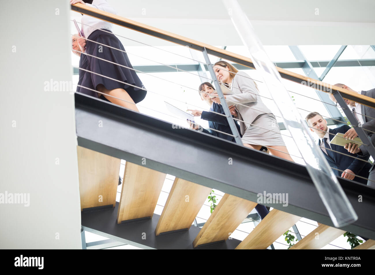 Woman walking upstairs in hi-res stock photography and images - Alamy