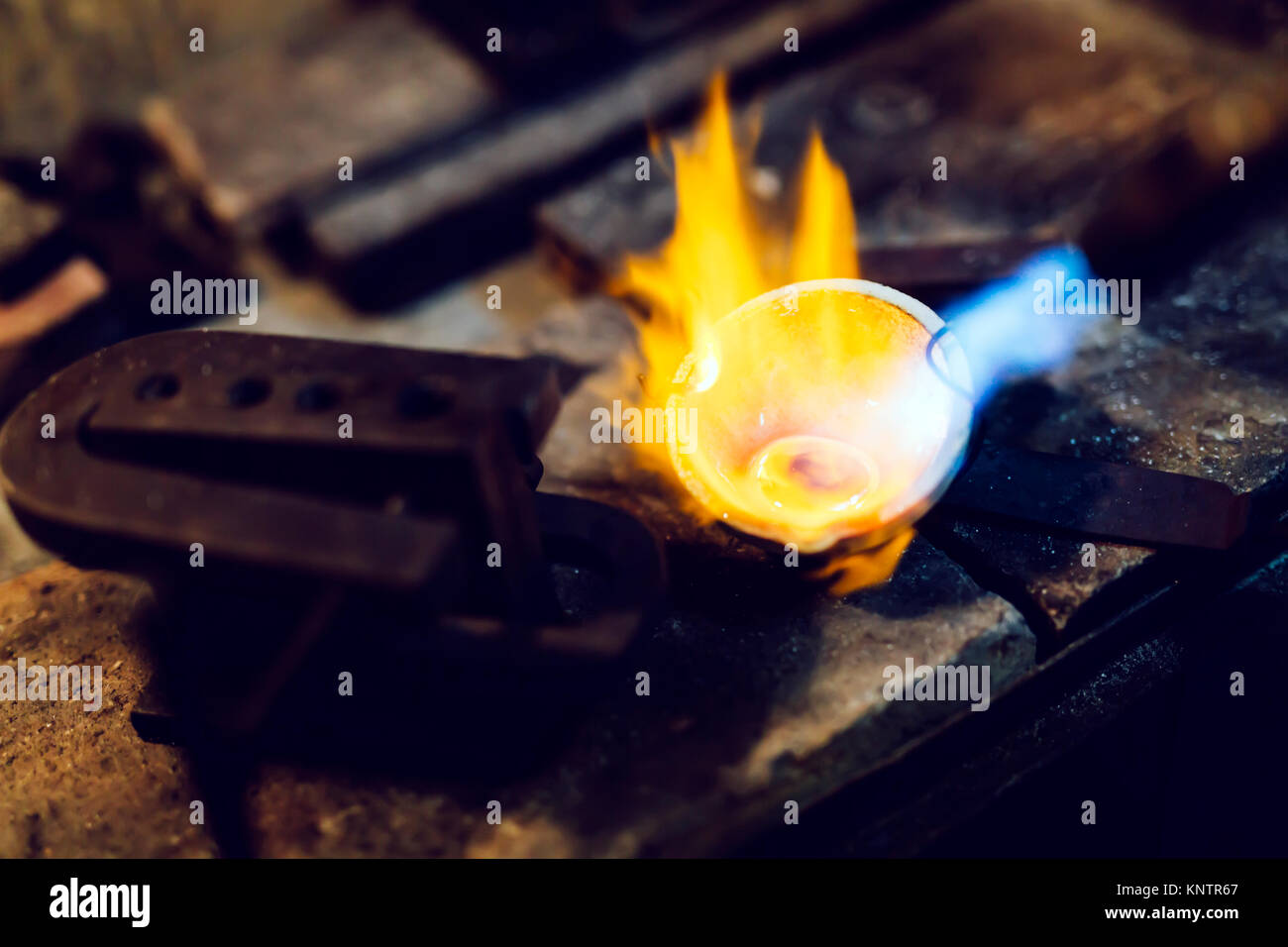Jeweler welding gold Stock Photo - Alamy